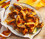 Sticky mango chicken wings | Tesco Real Food