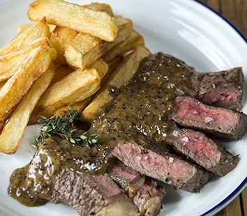 Ribeye steak and peppercorn sauce with chips | Tesco Real Food